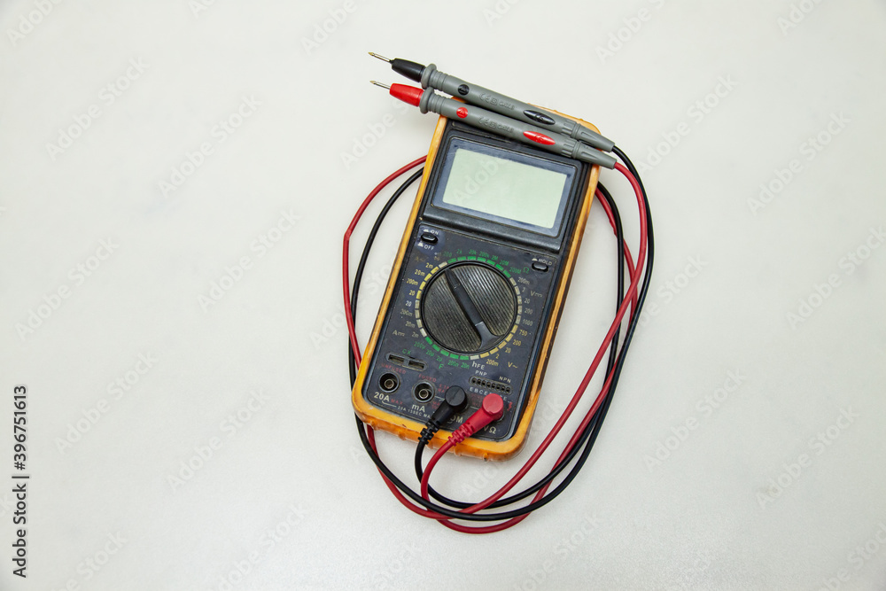 Yellow multimeter. Electronic measuring device. The multimeter measures ...