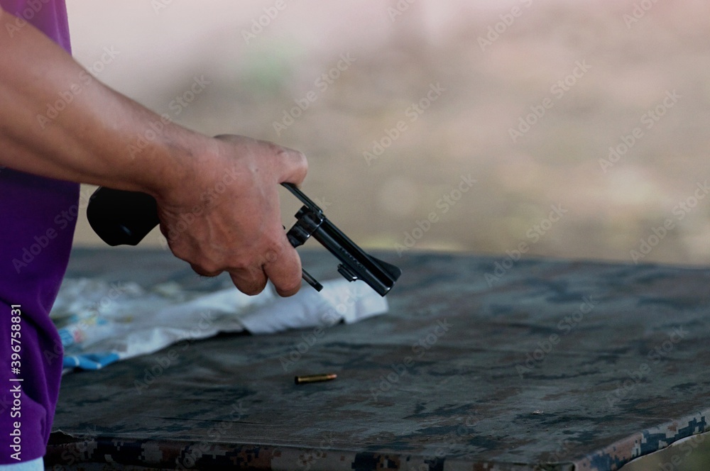 law enforcement aim pistol by two hand in academy shooting range in ...