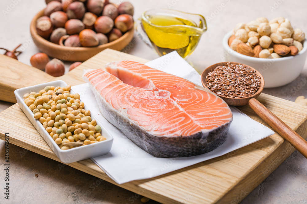 Omega 3 food sources and omega 6 on concrete background, top view copy ...