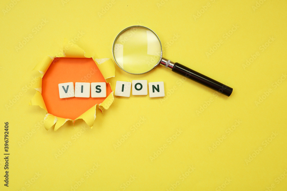 Block letters written Vision isolated on orange and yellow background ...