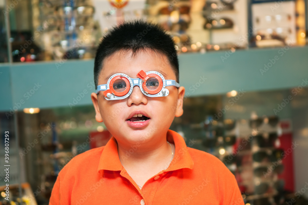 Young boy wearing optical trial frame to test vision Stock Photo ...