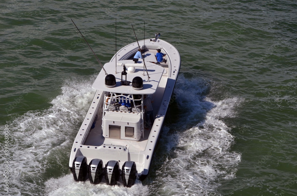 Overhead view of an open high-end fishing boat powered by four outboard ...