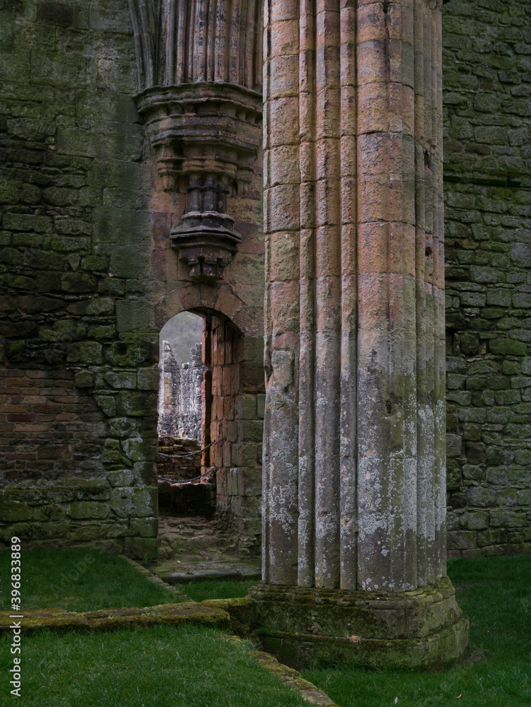 ruins of a medieval abbey with pillars and doorway during the reign of ...