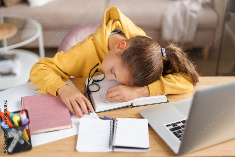 Top view of school girl is sleeping on open book while doing homework ...