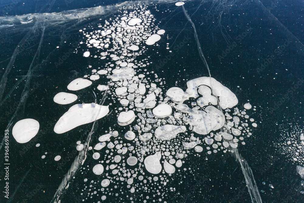 Trapped methane gas under the surface of the frozen lake from extreme ...