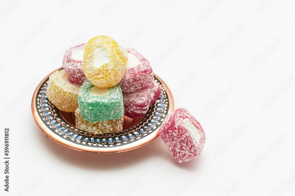 Colorful Turkish delight (aka lokum) in traditional bowl isolated on ...