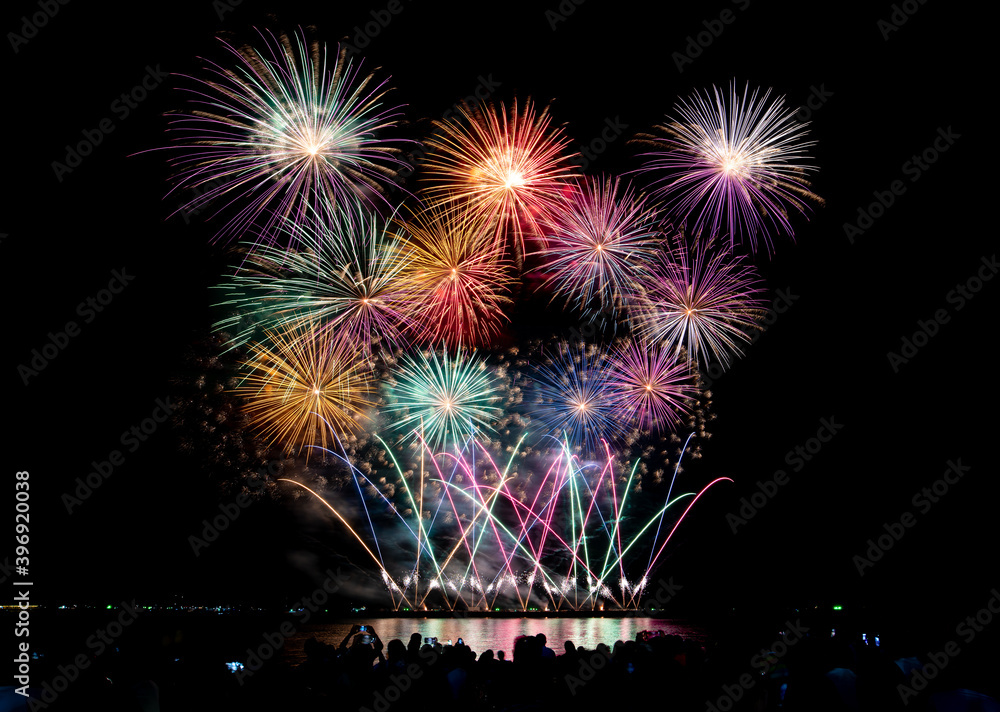 Fireworks light up the sky,Crowd watching fireworks and celebrating for ...