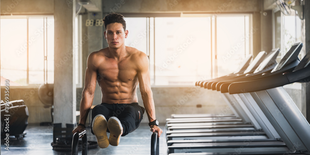 handsome and strong young man working out, Doing intense exercise in ...
