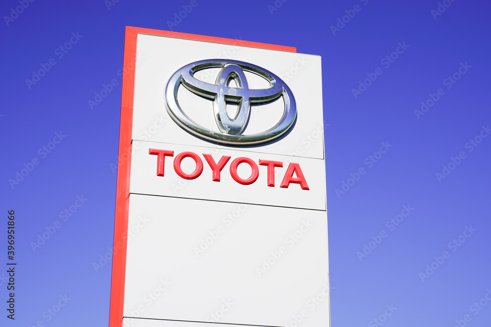 Toyota logo sign and text of dealership car Japanese brand of ...