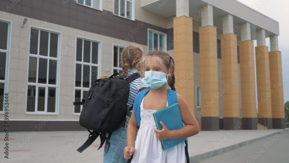 Children go back to school. Elbow greeting girls at school. Children ...