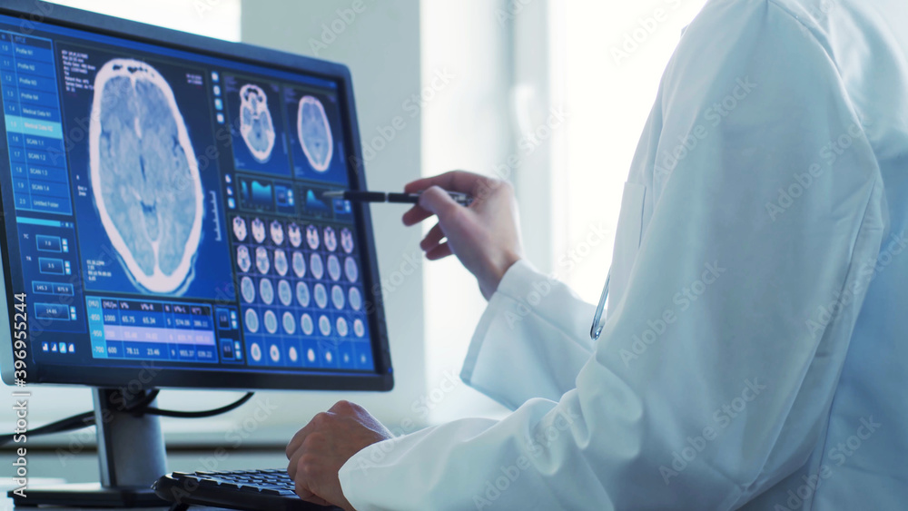 Professional medical doctor working in hospital office using computer ...