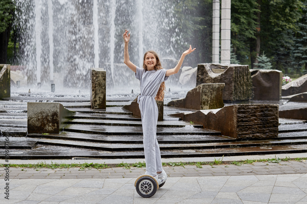 Beautiful girl rides a gyroscooter, hoverboard in the summer in the ...