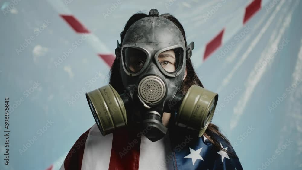 Portrait of a Close Up Woman With Gas Mask wearing usa flag. Healthcare ...