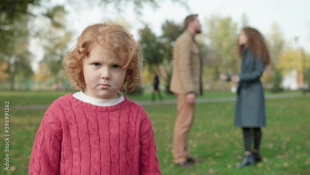 Sad child with arguing parents on background, family problem ...