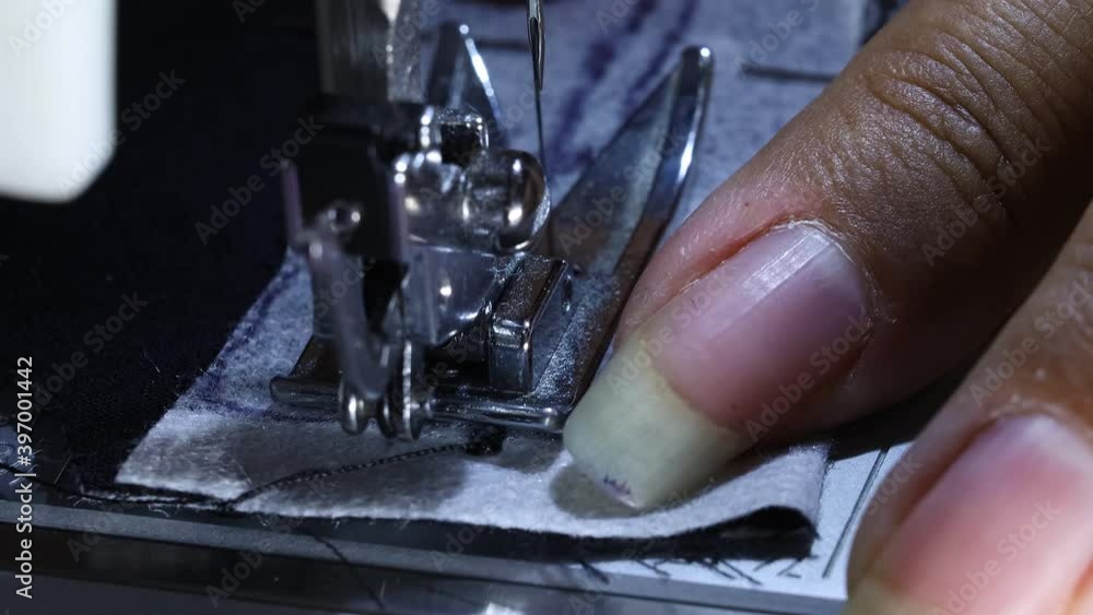 close up view of African American black hand with long nails using a ...