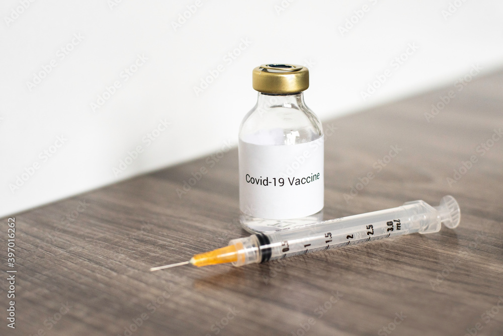 a vial with a medicine for the coronavirus, a vaccine for covid-19 with ...