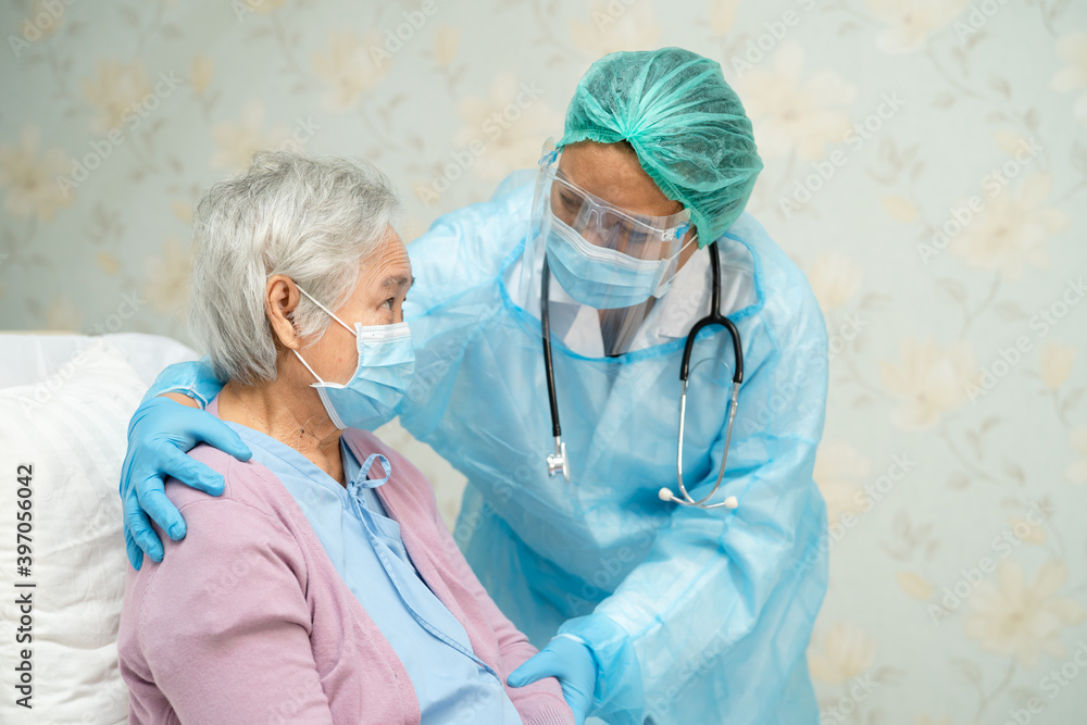 Asian doctor wearing face shield and PPE suit new normal to check ...