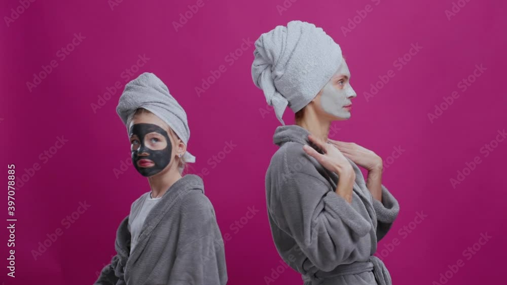 Joyful and funny female family couple of daughter with mother wearing ...