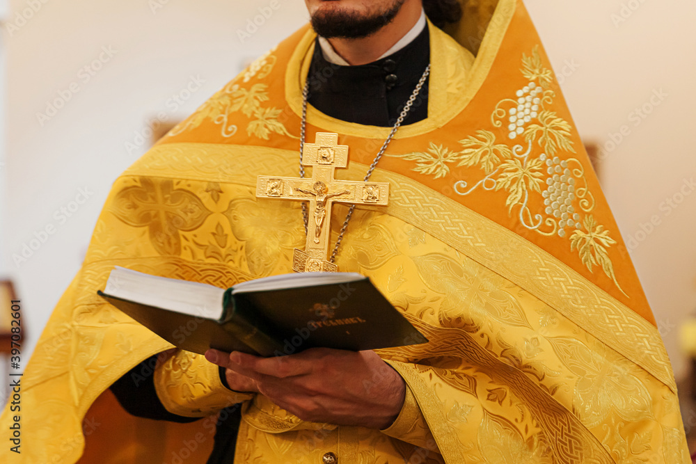 Orthodox Church. Christianity. Priest hands holding Holy Bible book in ...