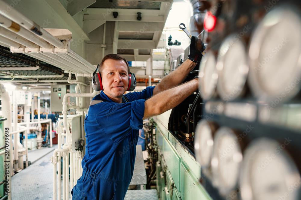 Marine engineer officer controlling vessel enginesand propulsion in ...