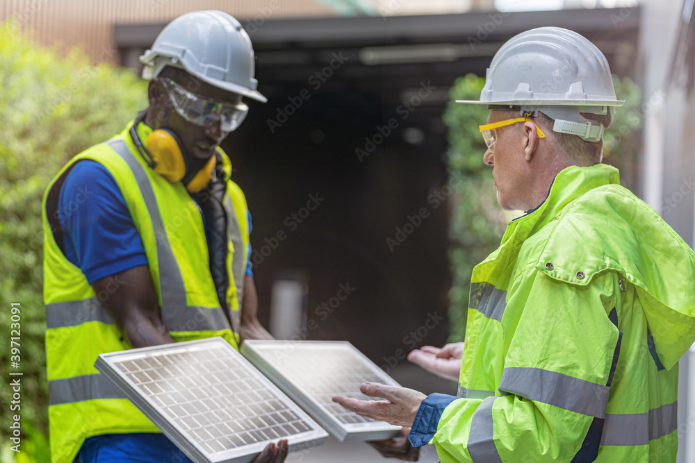 factory worker technician engineer men showing and checking solar cell ...