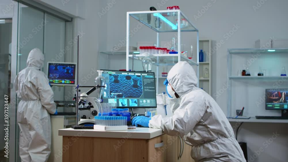 Chemist coworkers in ppe suit planning conducting vaccine against new ...