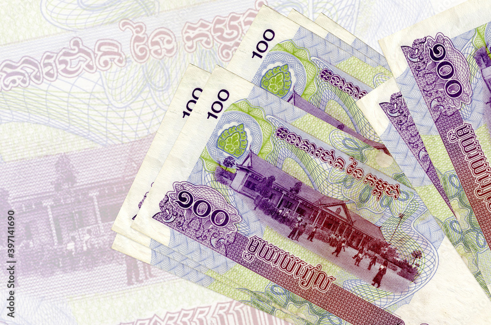 100 Cambodian riels bills lies in stack on background of big semi ...