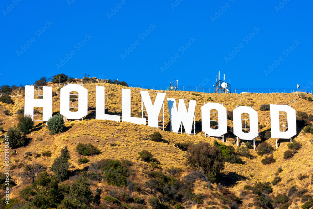 Hollywood sign white letters under blue sky on Mount Lee. The Hollywood ...