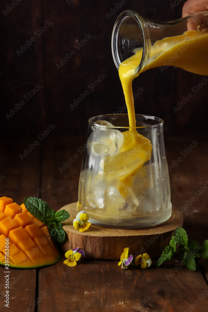 Jus mangga yoghurt or Yoghurt mango ice juice in a glass Stock Photo ...