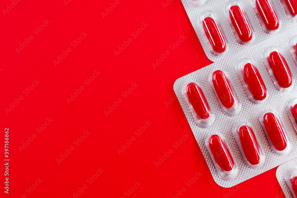 Tablets are placed on a Colored red background. Protection from viral ...