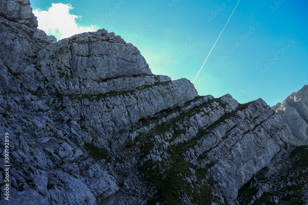 A panoramic view on Alpine slopes in Austria. There are sharp ans steep ...