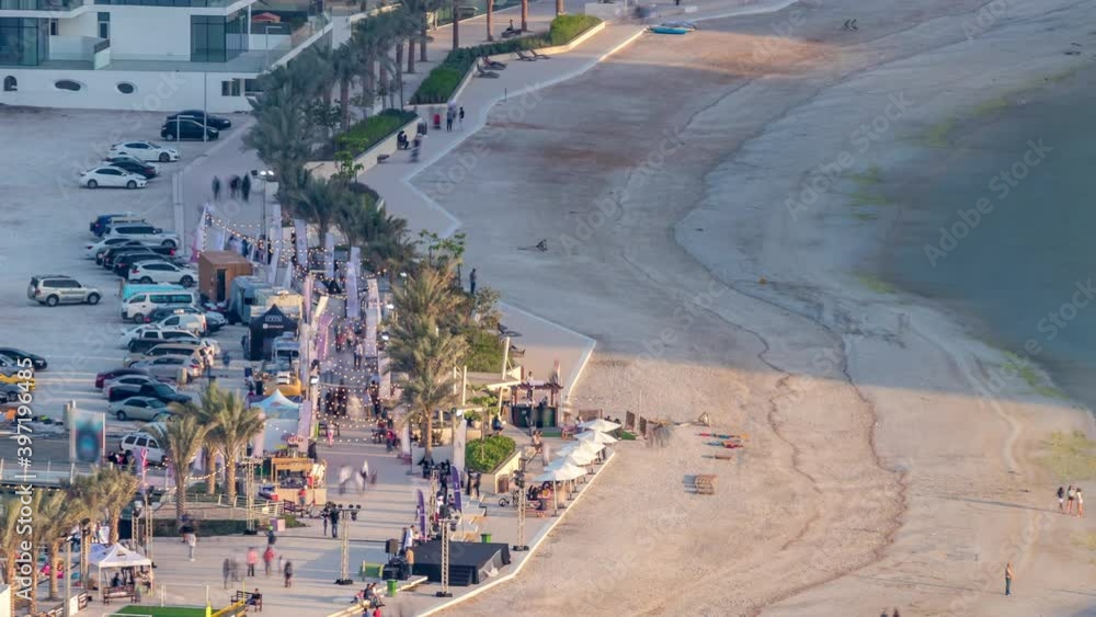 Beach on Al Reem Island in Abu Dhabi during sunset timelapse from above ...