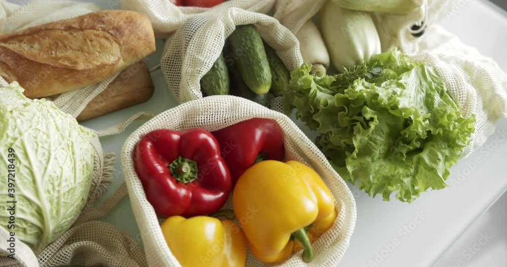 Video „Vegetables, fruits in reusable eco cotton bags on table. Zero ...