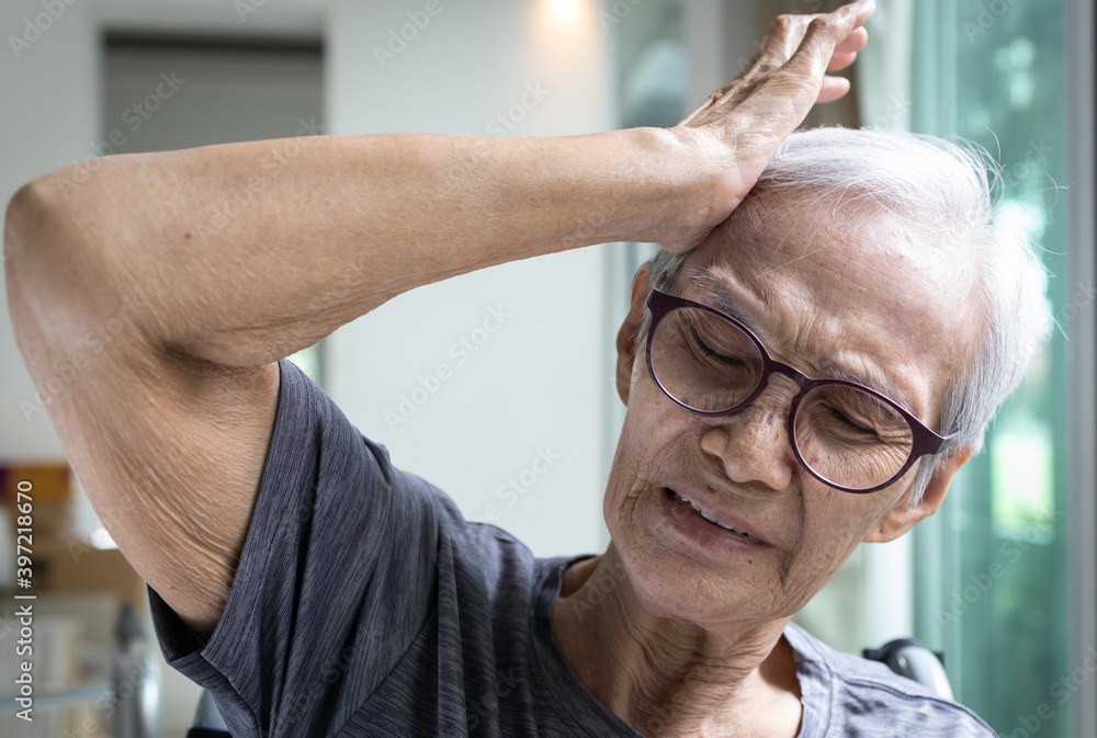 Senior woman suffering from severe headache,touch her temples,nerve ...