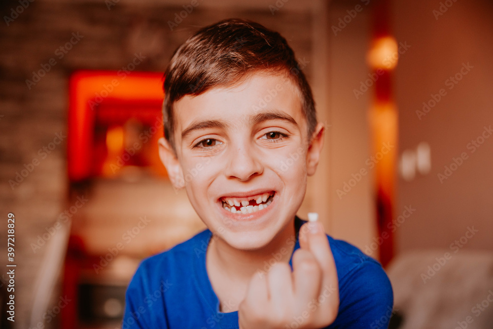 A cute smiling little boy shows a tooth that fell out Stock Photo ...