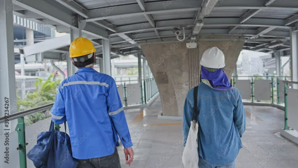 Asian Two construction workers wearing uniform And hard hat Traveling ...