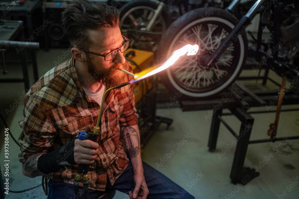 Men build a motorcycle Stock Photo | Adobe Stock