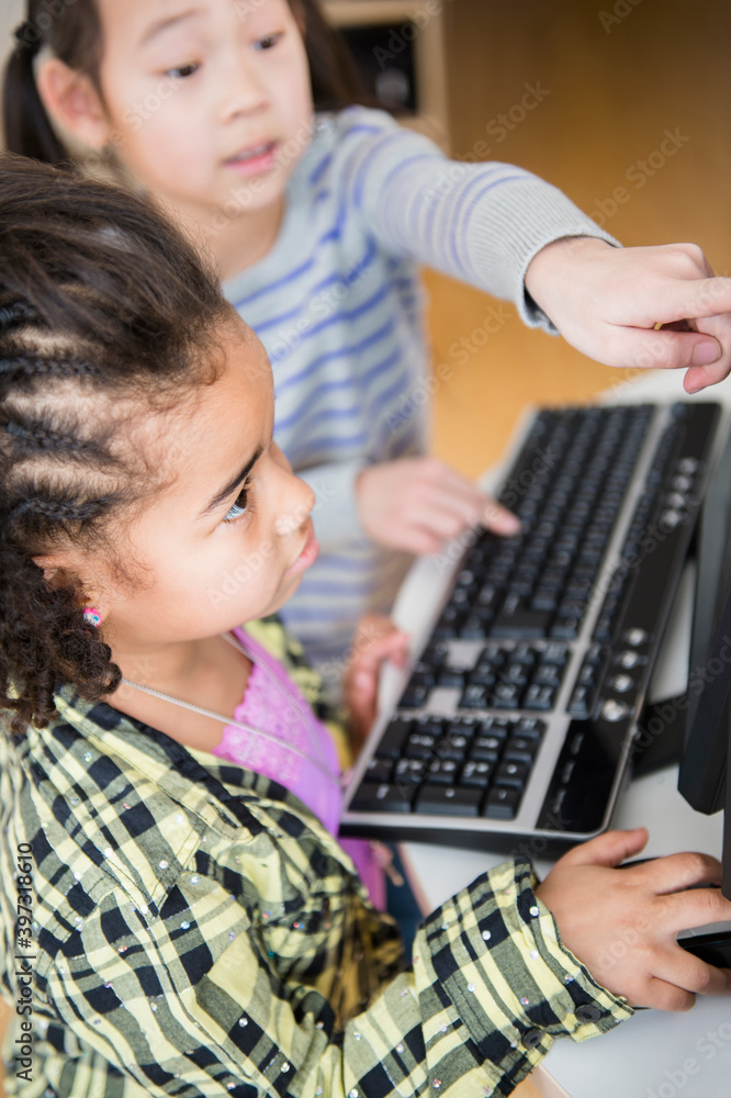 Children using computer together Stock Photo | Adobe Stock