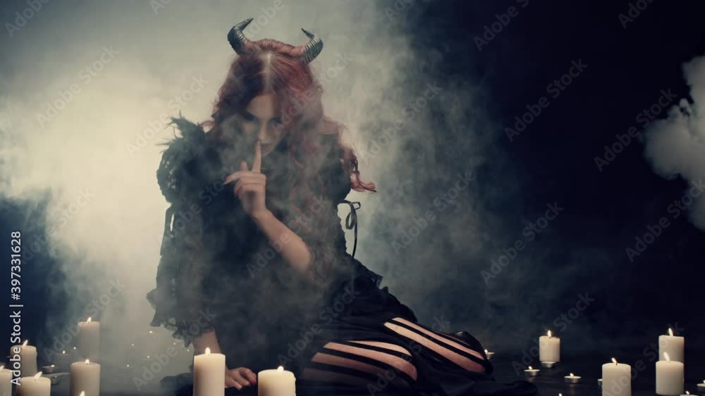 Vidéo Stock Woman dressing in dark casts, spelling, conducting ritual ...