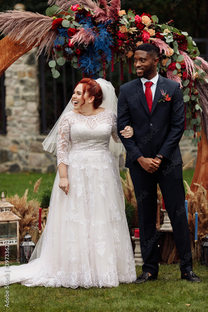 Lovely couple on wedding ceremony, handsome African American man with ...