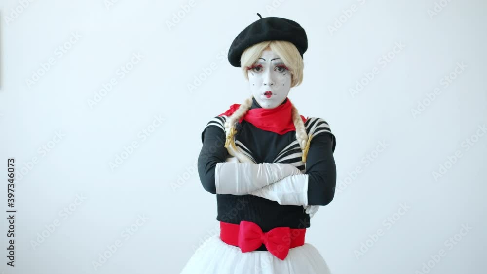Portrait of cute girl mime standing with arms crossed and shaking head ...