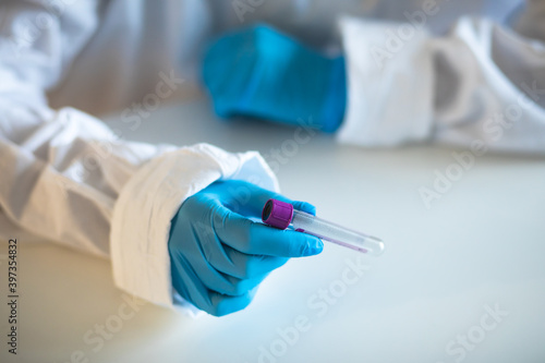 Process of coronavirus testing examination by nurse medic in laboratory ...