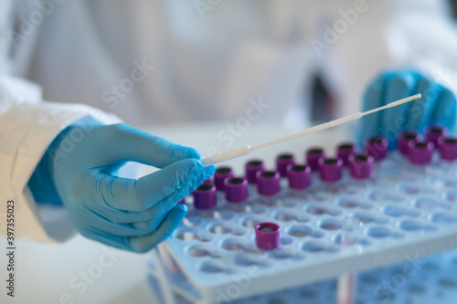 Process of coronavirus testing examination by nurse medic in laboratory ...