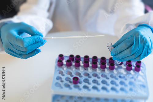 Process of coronavirus testing examination by nurse medic in laboratory ...