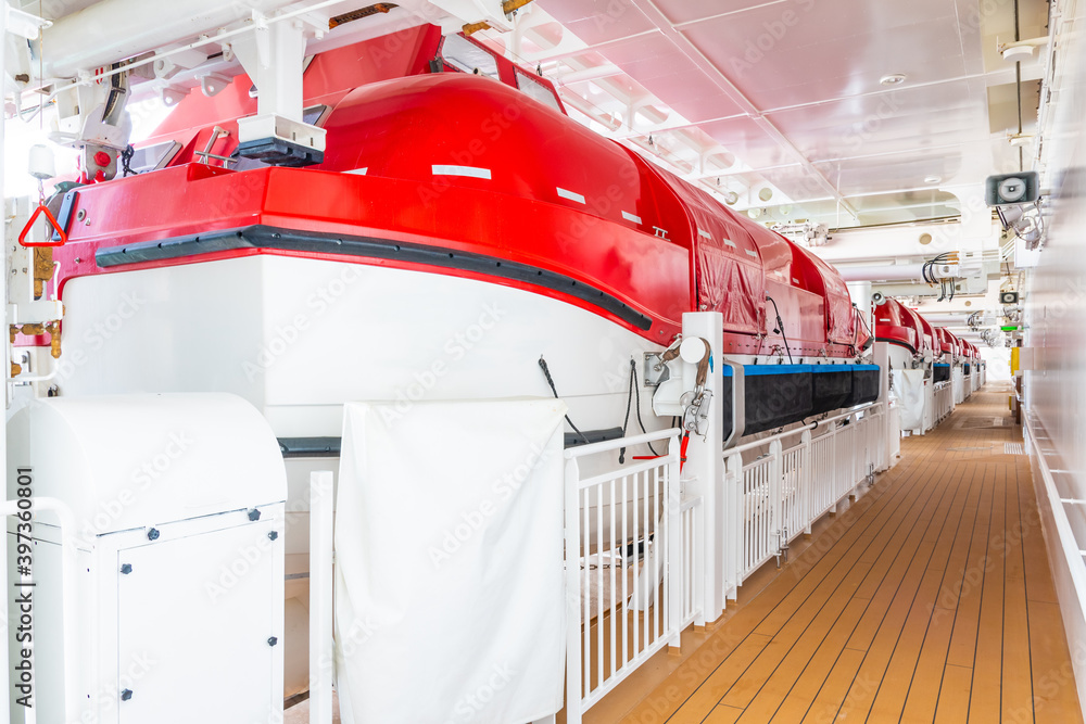 Lifeboats or liferafts on cruise ship deck for emergency evacuation in ...