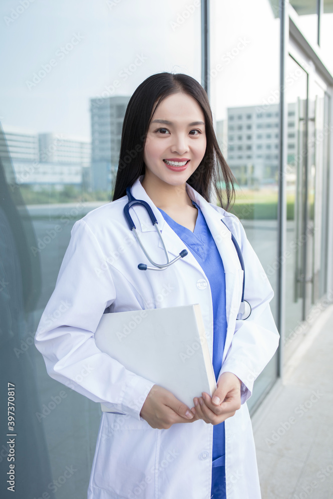 Young Asian doctor woman smile face reading book with stethoscope on ...