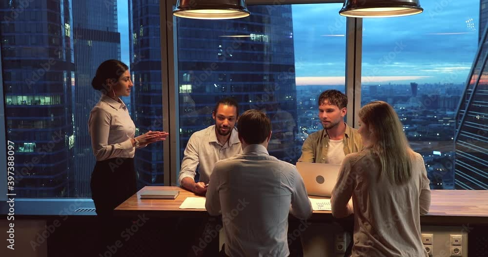 Multiethnic startup business team gathered in modern office boardroom ...