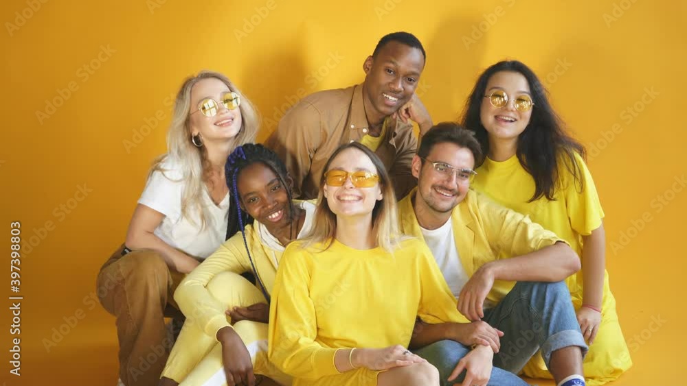Cheerful positive group of young people of diverse nationalities posing ...