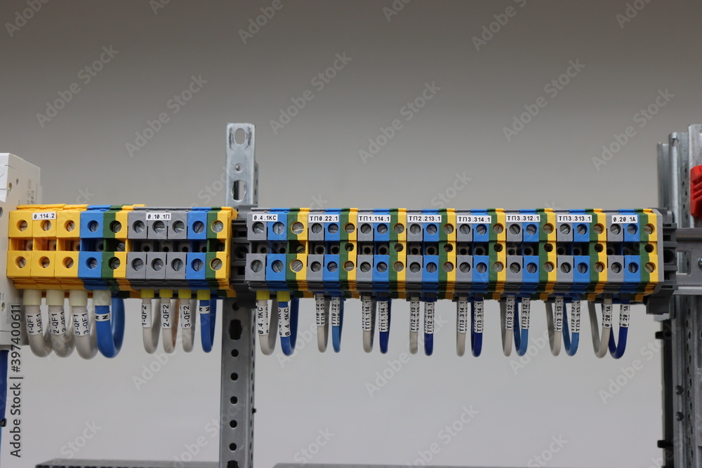 Pass-through terminals for connecting loads in electrical panels ...