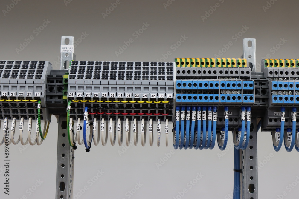Pass-through terminals for connecting loads in electrical panels ...